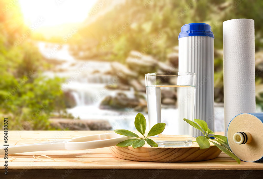 Purified water with nature background with trees and waterfall front ...