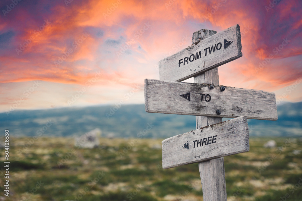 from two to three text quote caption on wooden signpost outdoors in ...