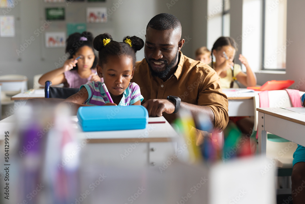 African american young male teacher teaching african american ...