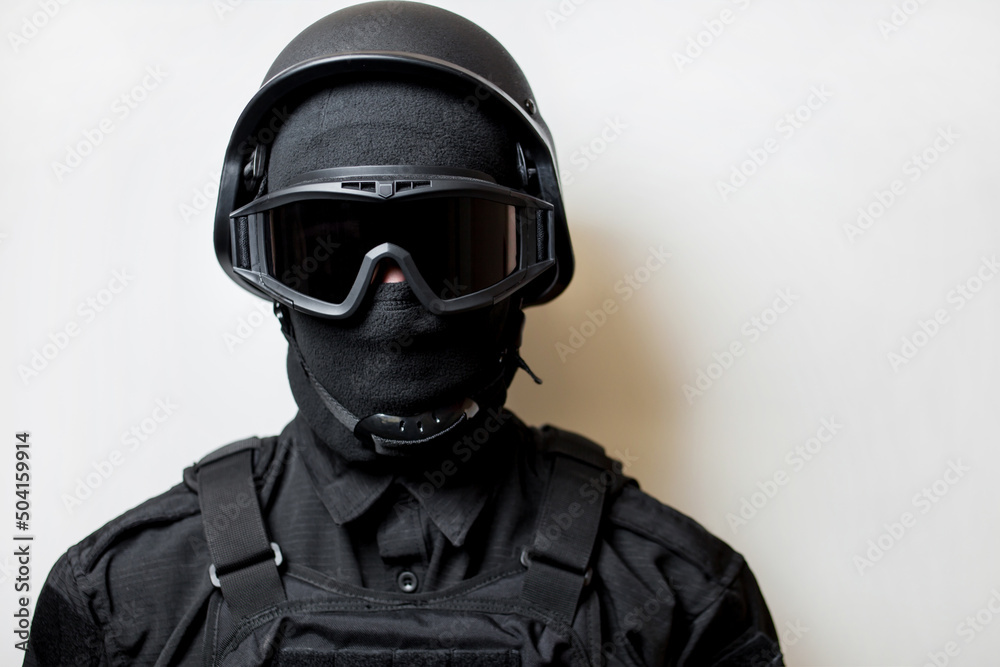 Special Forces in black uniform, mask and body armor. Special Forces ...