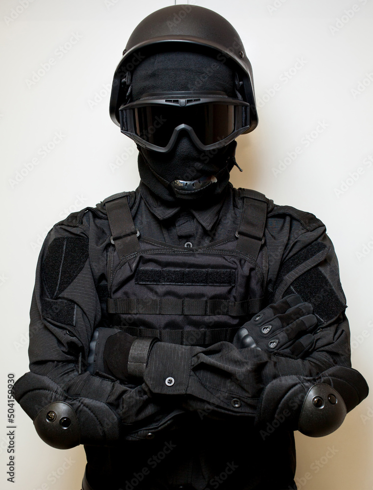 Special Forces in black uniform, mask and body armor. Special Forces ...