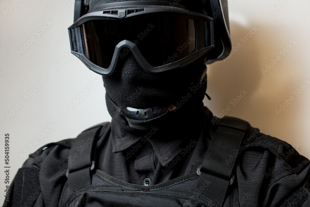 Special Forces in black uniform, mask and body armor. Special Forces ...