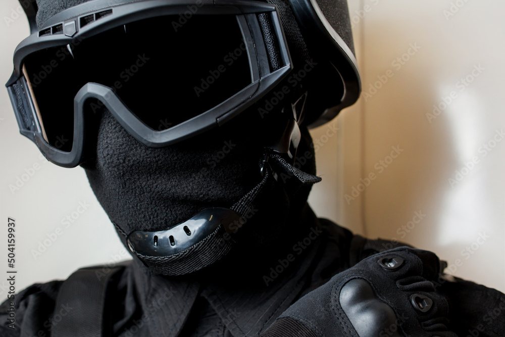 Special Forces in black uniform, mask and body armor. Special Forces ...