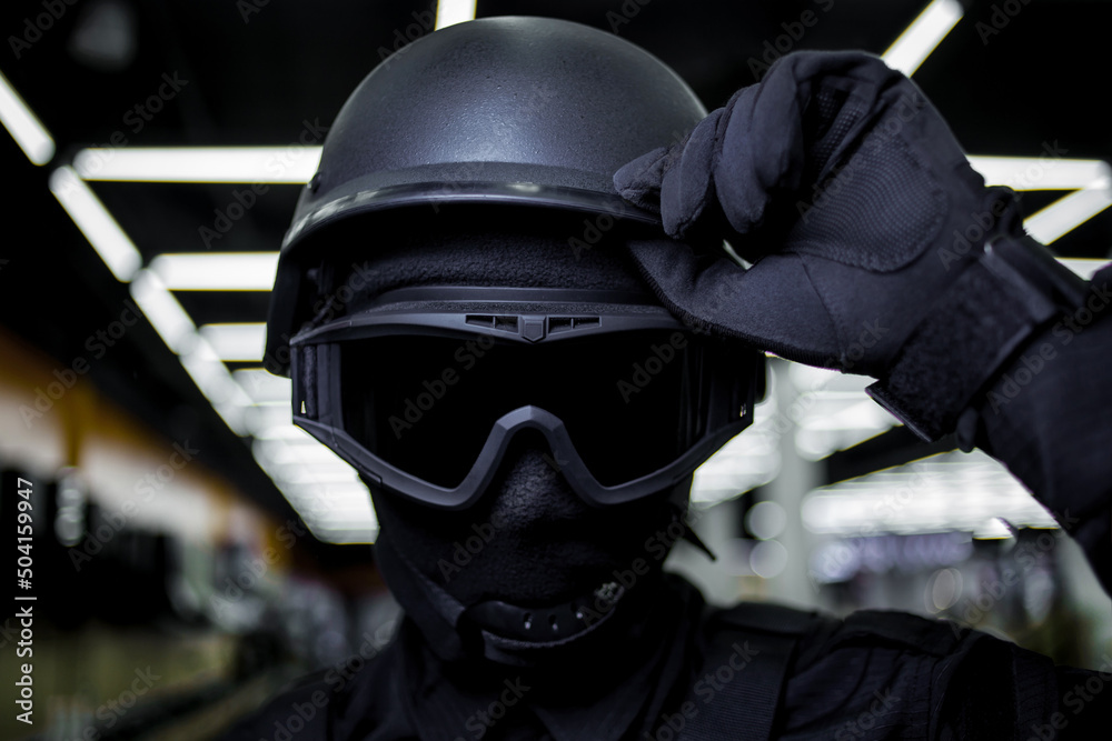 Special Forces in black uniform, mask and body armor. Special Forces ...