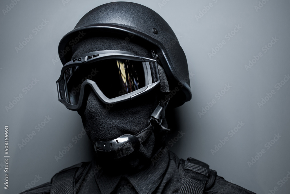 Special Forces in black uniform, mask and body armor. Special Forces ...