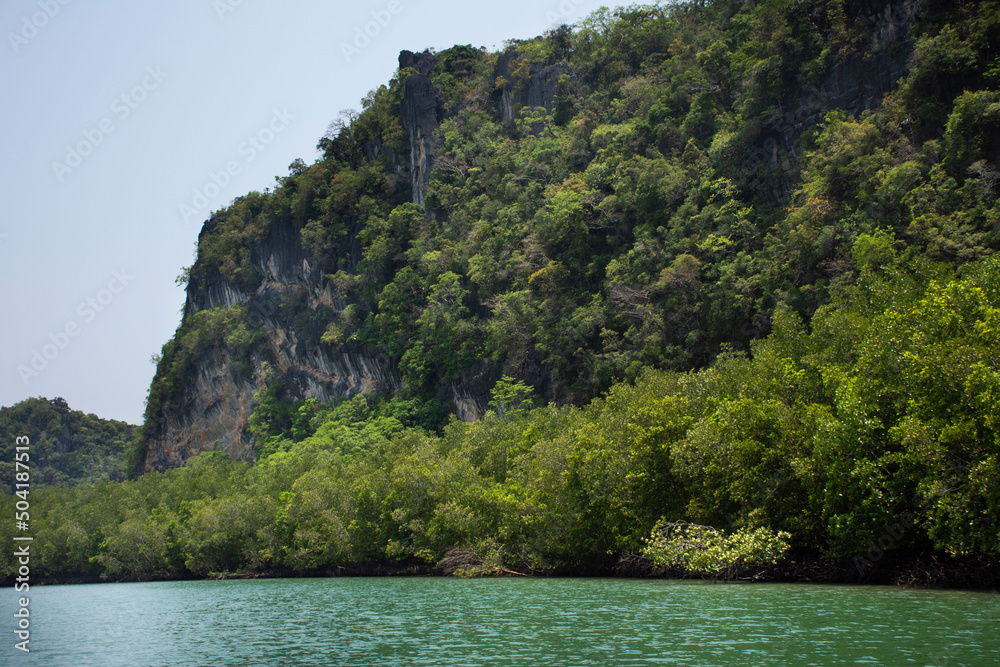 Limestone mountain island in sea ocean for thai people travelers travel ...