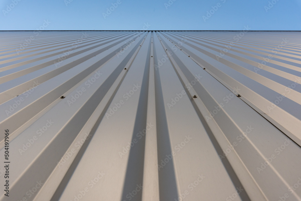 trapezoid corrugated sheet metal Facade of a warehouse. Stock Photo ...