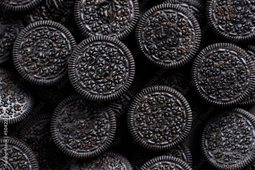 Textured dark background with circle shape cookies black color ...