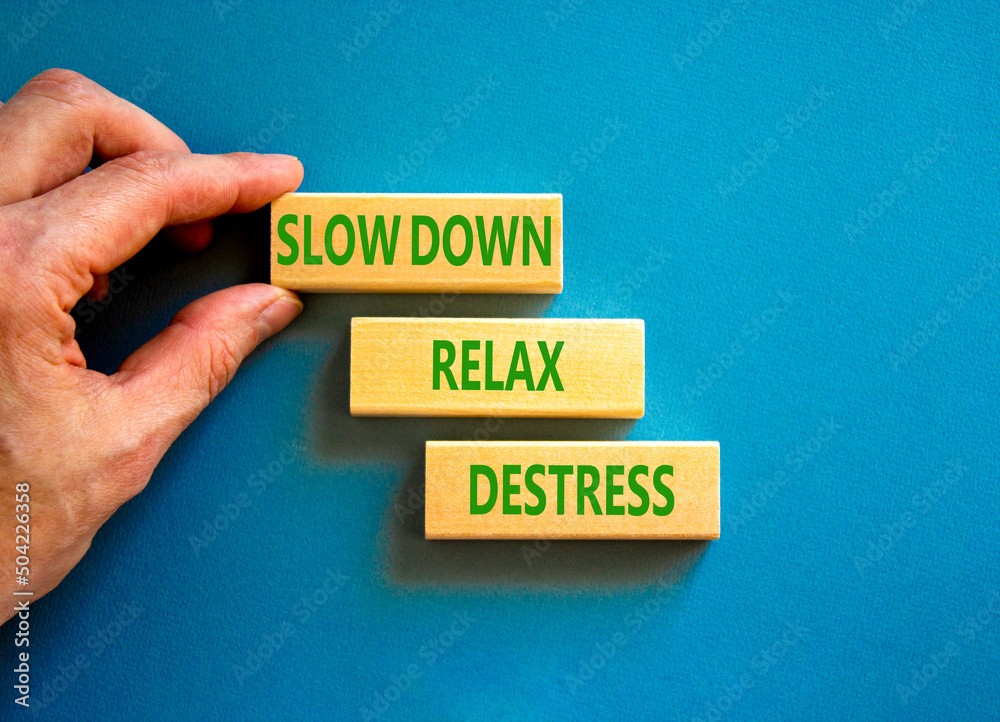 Destress symbol. Concept words Slow down Relax Destress on wooden ...