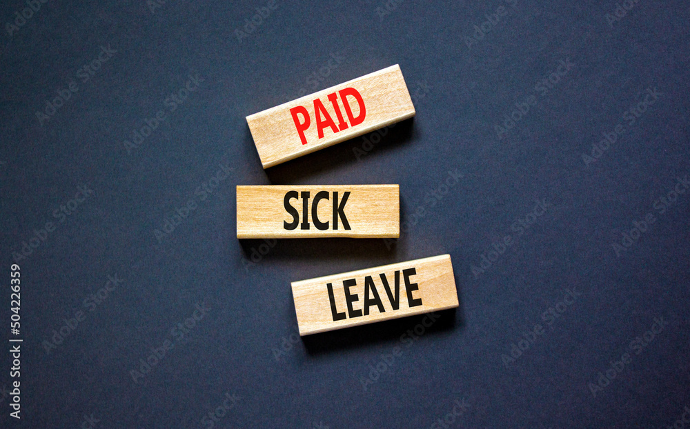 Paid sick leave symbol. Concept words Paid sick leave on wooden blocks ...