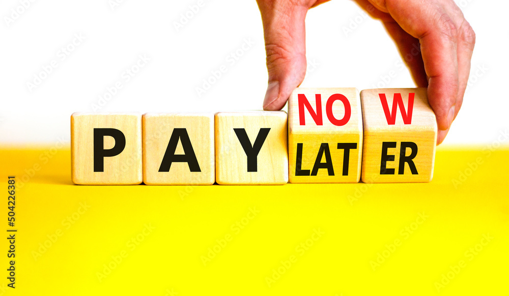 Pay later or now symbol. Businessman turns wooden cubes and changes ...