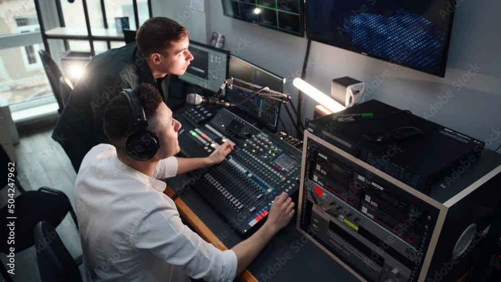 Two radio station workers in in the studio live together Stock-Video ...