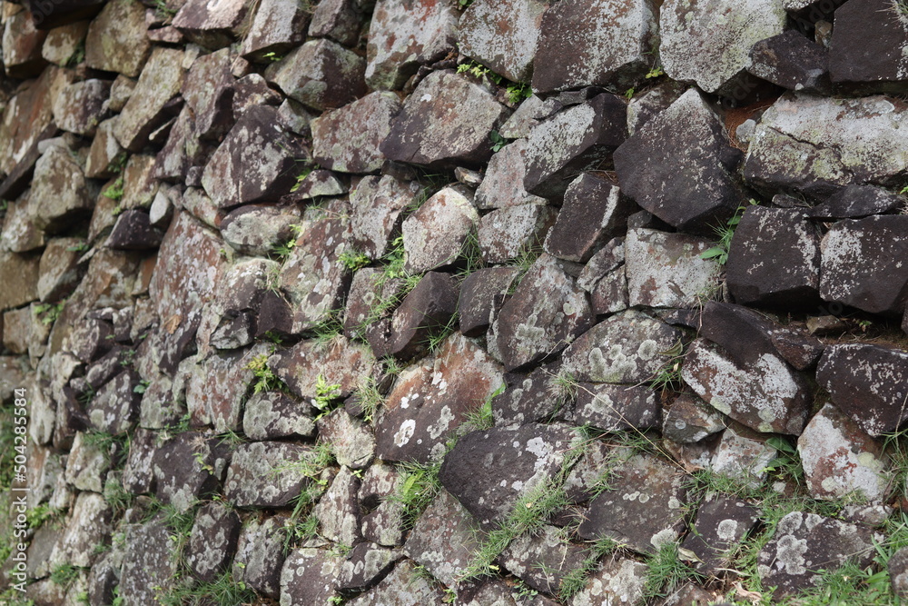 elongated rock formations that are stacked on each other on the walled ...