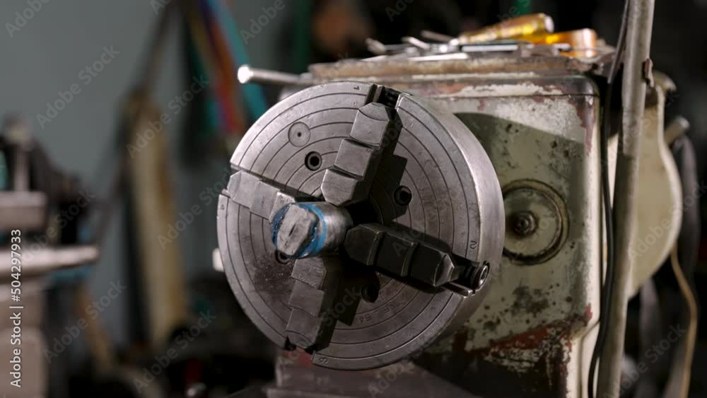 4K 50fps, Close-up of the iron plugged into the lathe, rotating ...