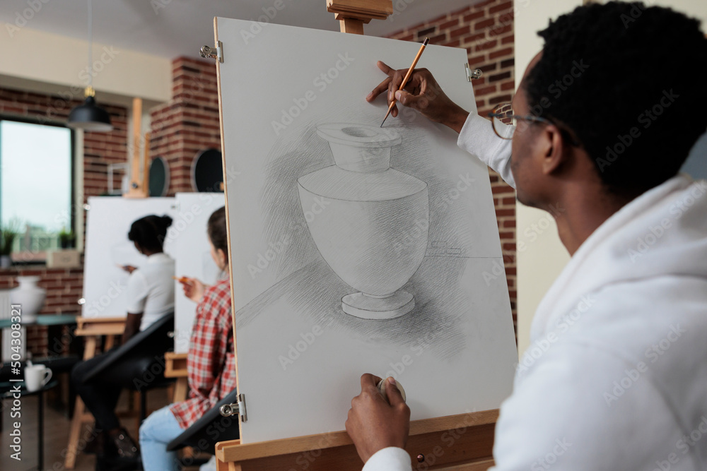 African american student attending art lesson working at creative ...