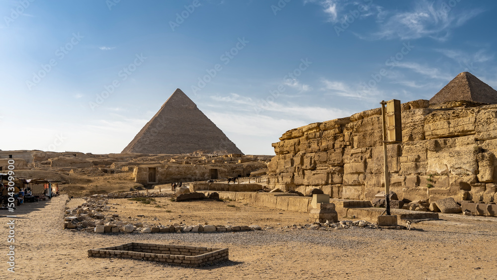 Archaeological complex on the Giza plateau. Dilapidated stone walls are ...