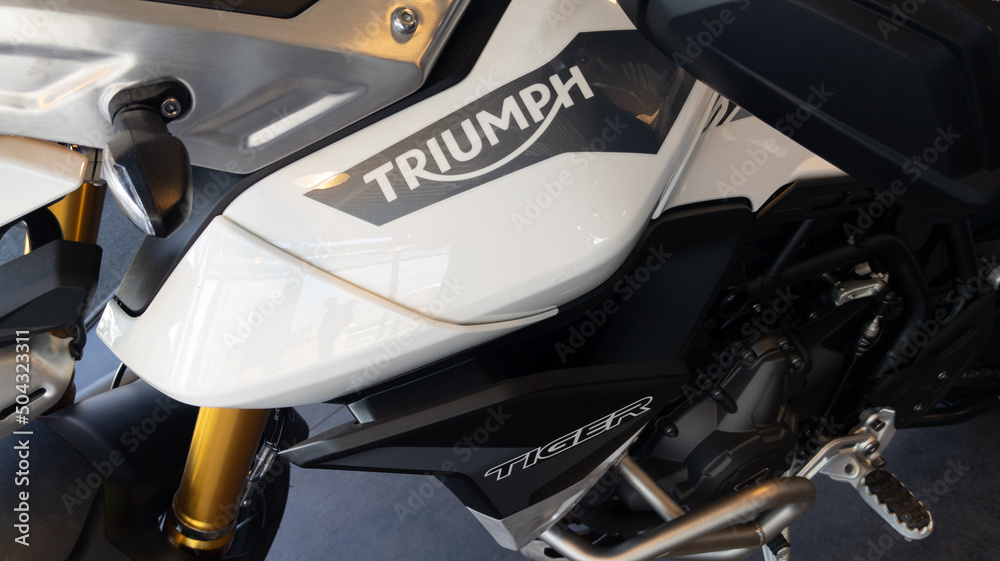 triumph tiger motorcycle detail sign text and brand logo on fuel tank ...