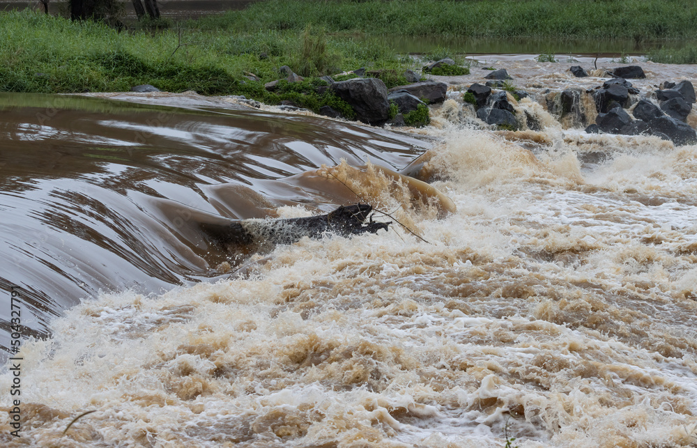 Overflowing weir during Queensland floods Stock Photo | Adobe Stock