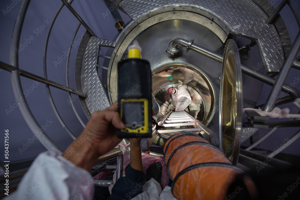Worker hand holding gas detector inspection safety gas testing at front ...