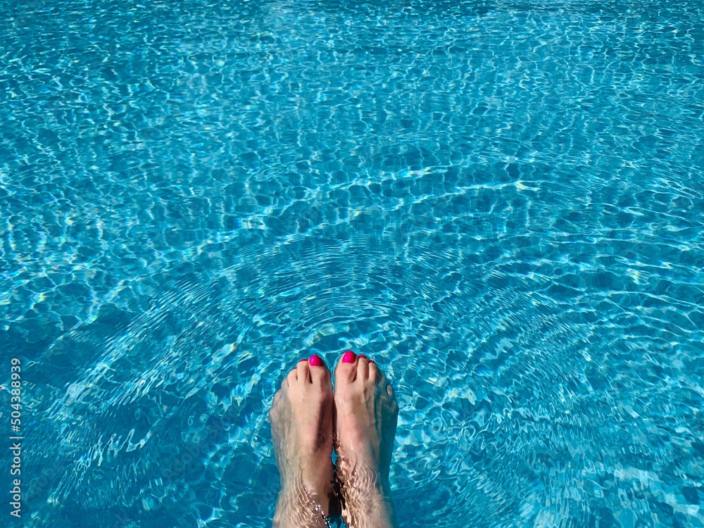 Female feet in swimming pool. Summer vacation copy space Stock Photo ...