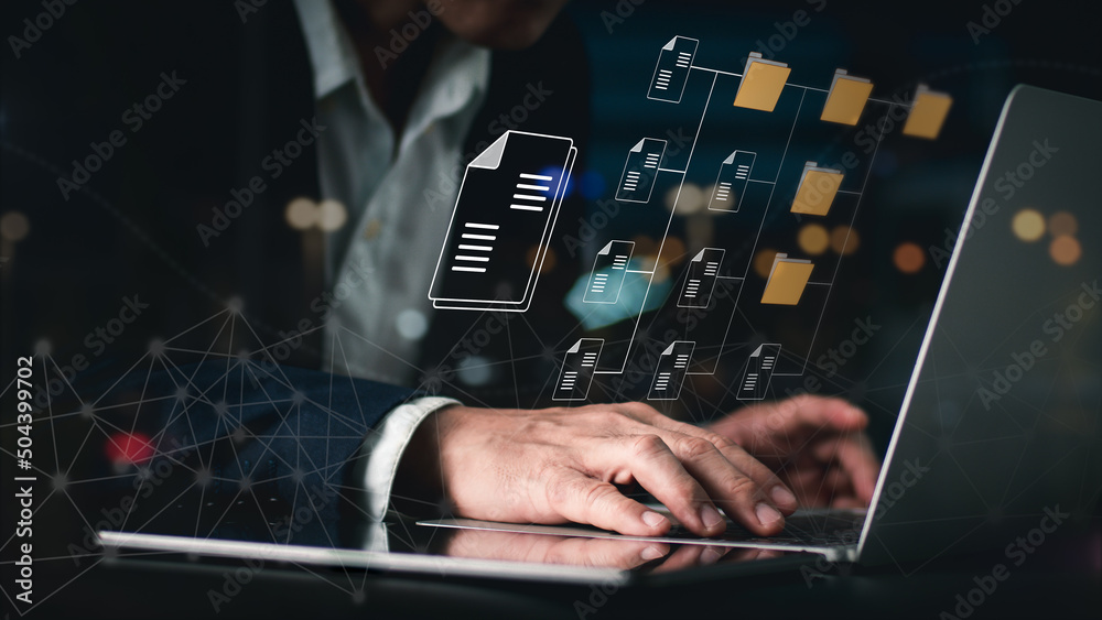 A guy using a Document Management System (DMS), an online documentation database, and process ...