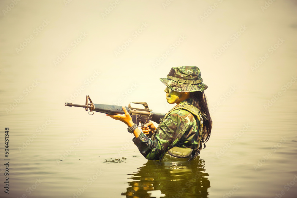 soldier with a rifle.Army soldier in protective uniform holding rifle ...