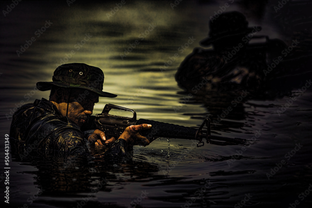 soldier with a rifle.Army soldier in protective uniform holding rifle ...