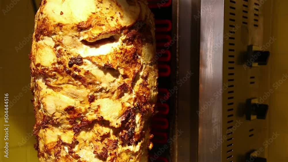Video „Skewered roasted chicken shawarma meat cooking and turning on ...