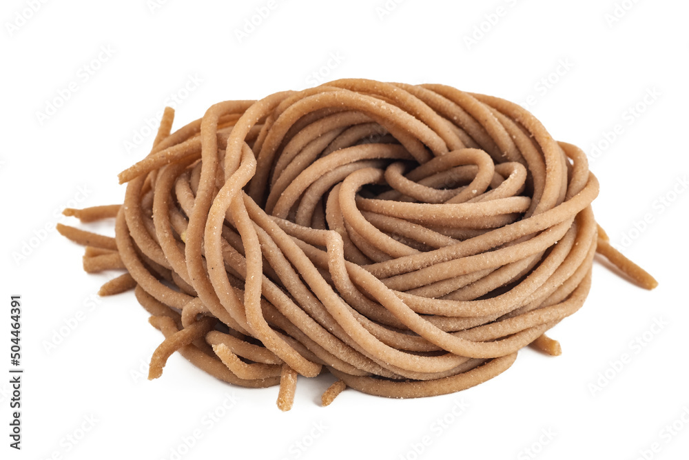 Raw whole-grain brown Spaghetti paste isolated on a white background ...