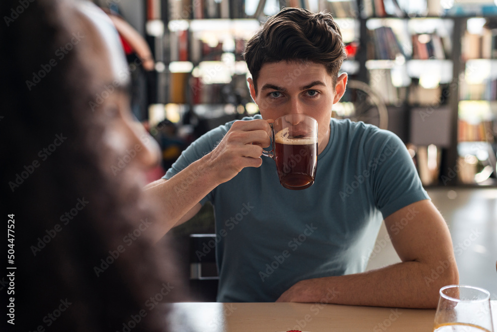 Authentic male drinking coffee in a modern loft Stock Photo | Adobe Stock