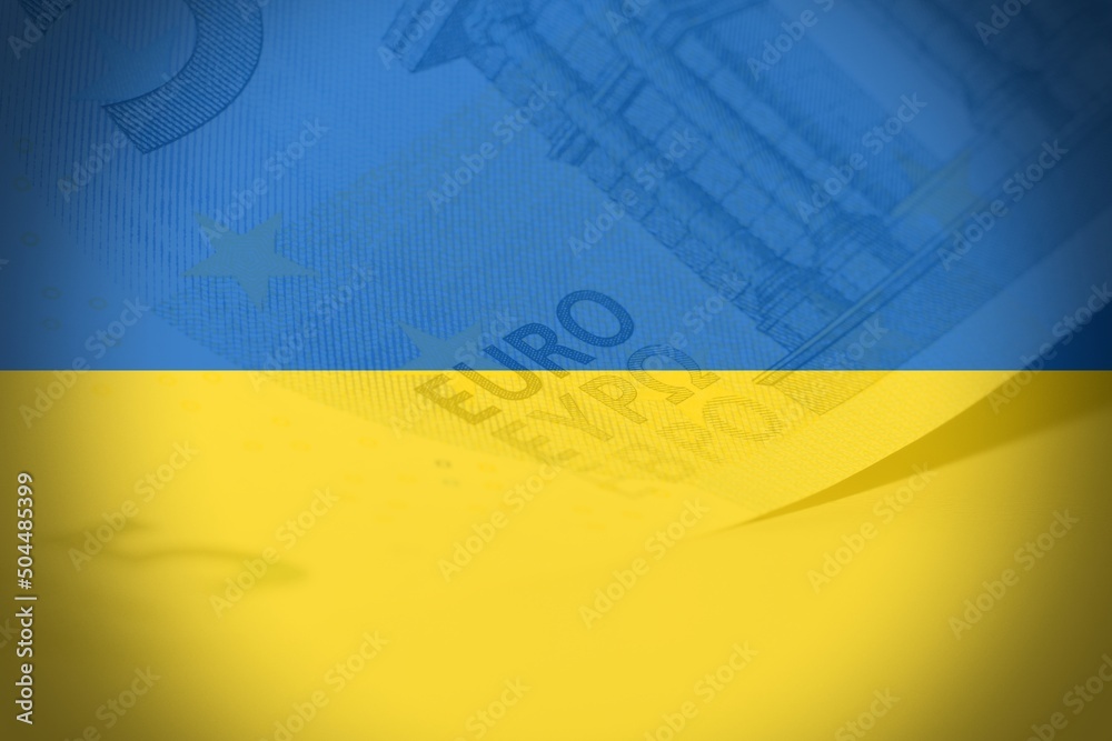 Euro money with a background of the Ukraine flag. Stock Photo | Adobe Stock
