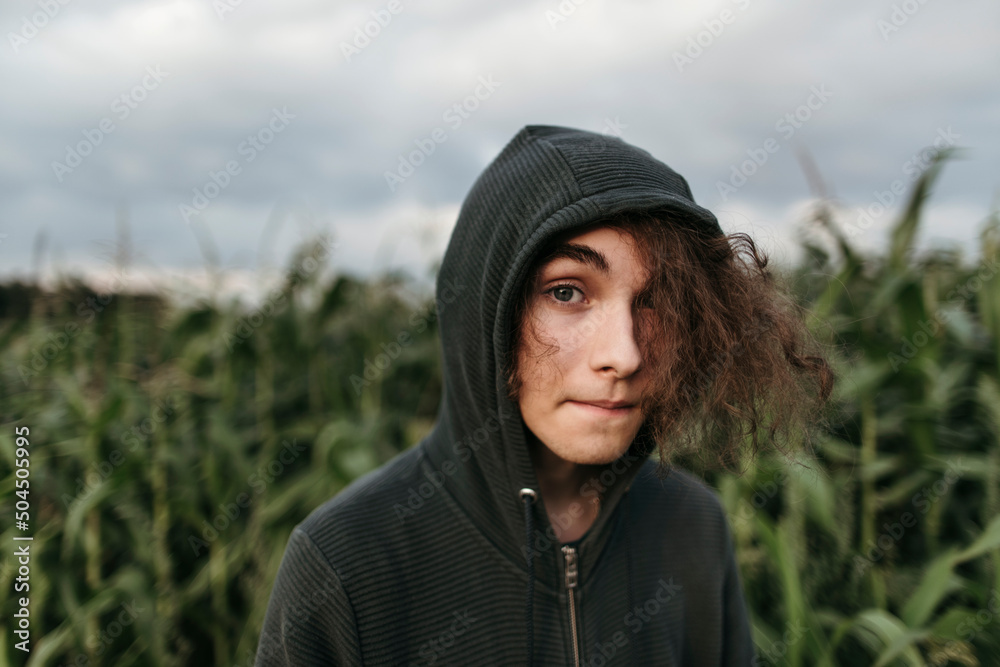 Brooding teen boy outdoor. Stock Photo | Adobe Stock