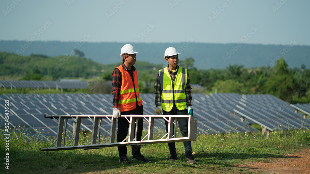 Concept: Renewable Energy. Team of engineers working to check the ...