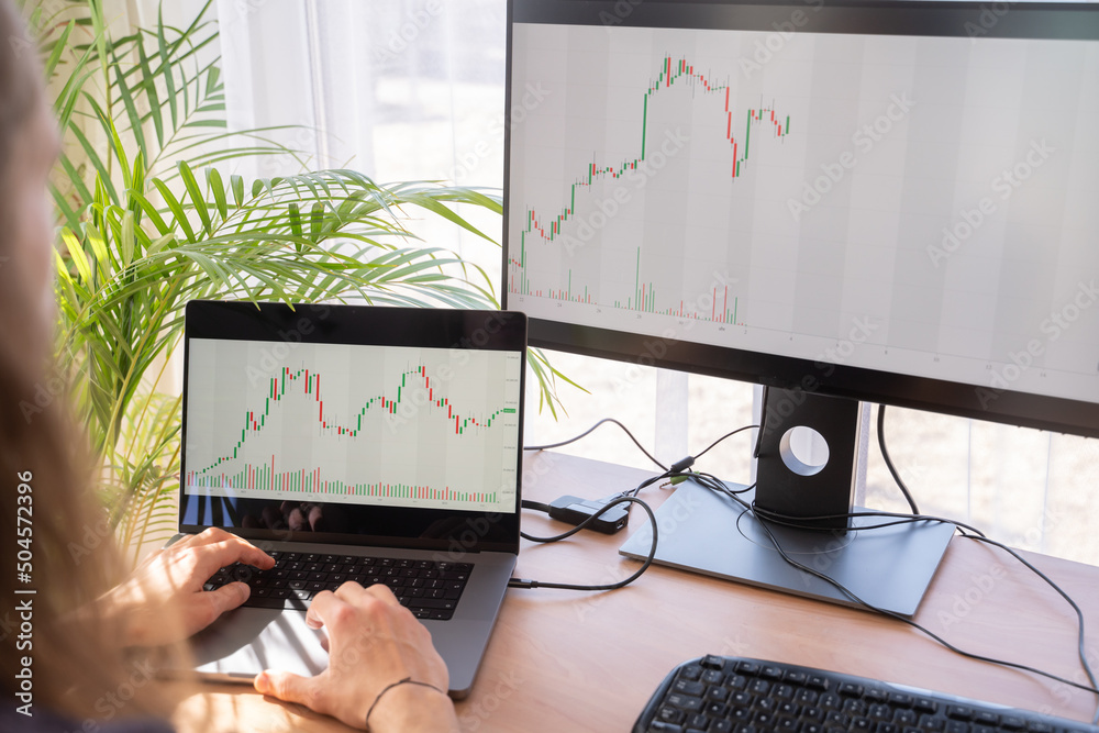 Anonymous Man Analysing Charts Stock Photo | Adobe Stock