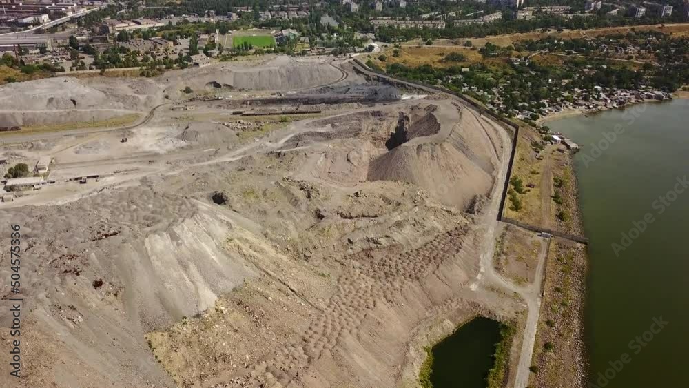 Aerial of metallurgical plants slag, scrap dump heap from metallurgical ...