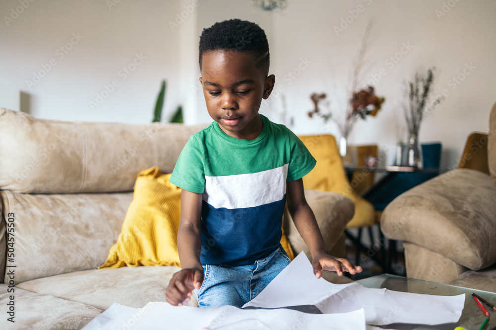 Little boy drawing at home Stock Photo | Adobe Stock