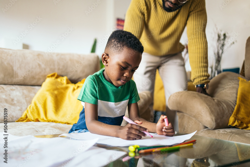 Little boy drawing at home Stock Photo | Adobe Stock