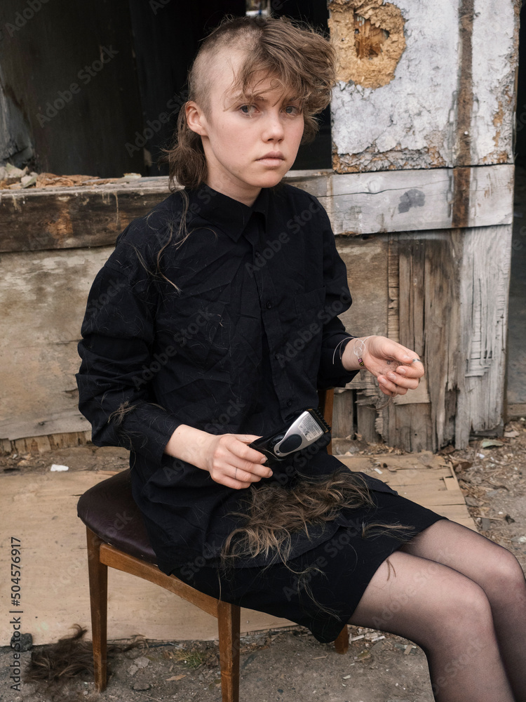 Young girl cuts her head bald Stock Photo | Adobe Stock