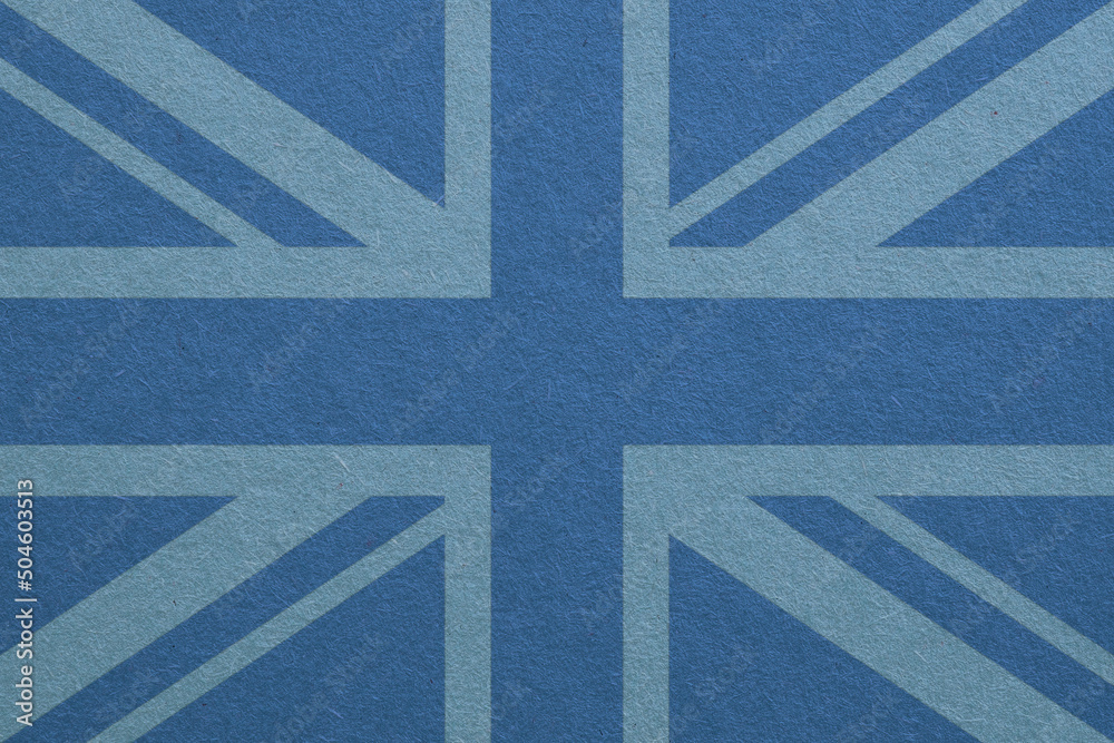 British flag outline on blue cardboard surface. Paper texture with ...