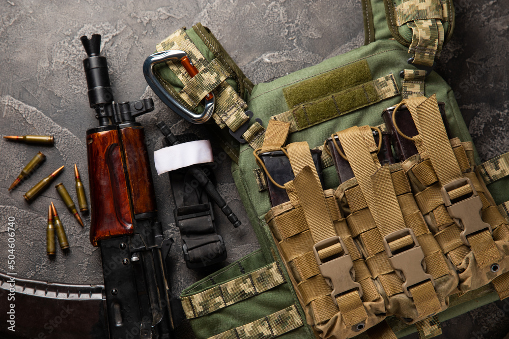 Military body armor, helmet and ammunition, a Kalashnikov assault rifle ...