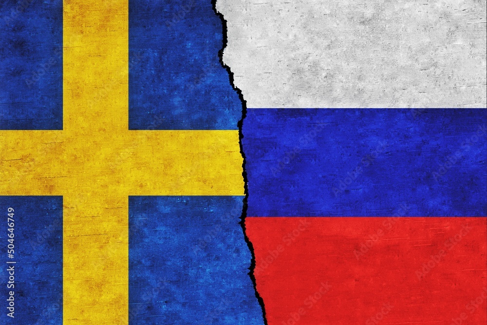 Russia and Sweden painted flags on a wall with a crack. Russia and ...