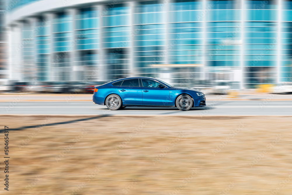 Audi S5 Sportback fast moving blue car with motion blur effect ...