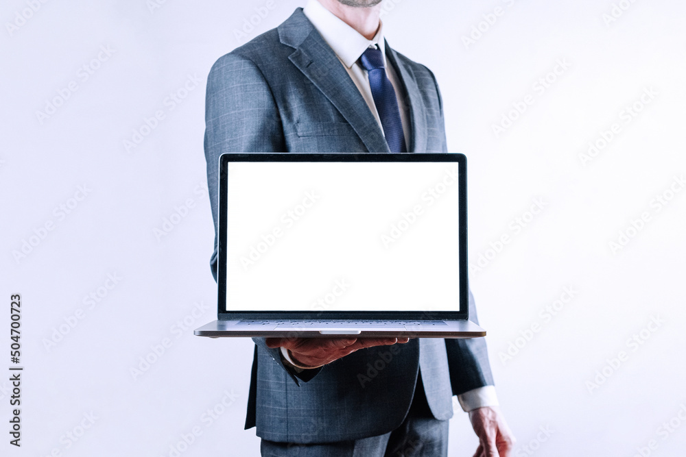 Laptop mockup computer screen. Businessman holding notebook. Empty ...
