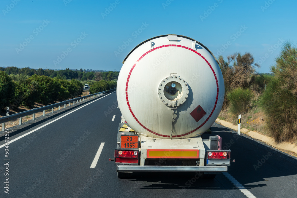 Tanker truck with dangerous goods plates circulating on the highway ...