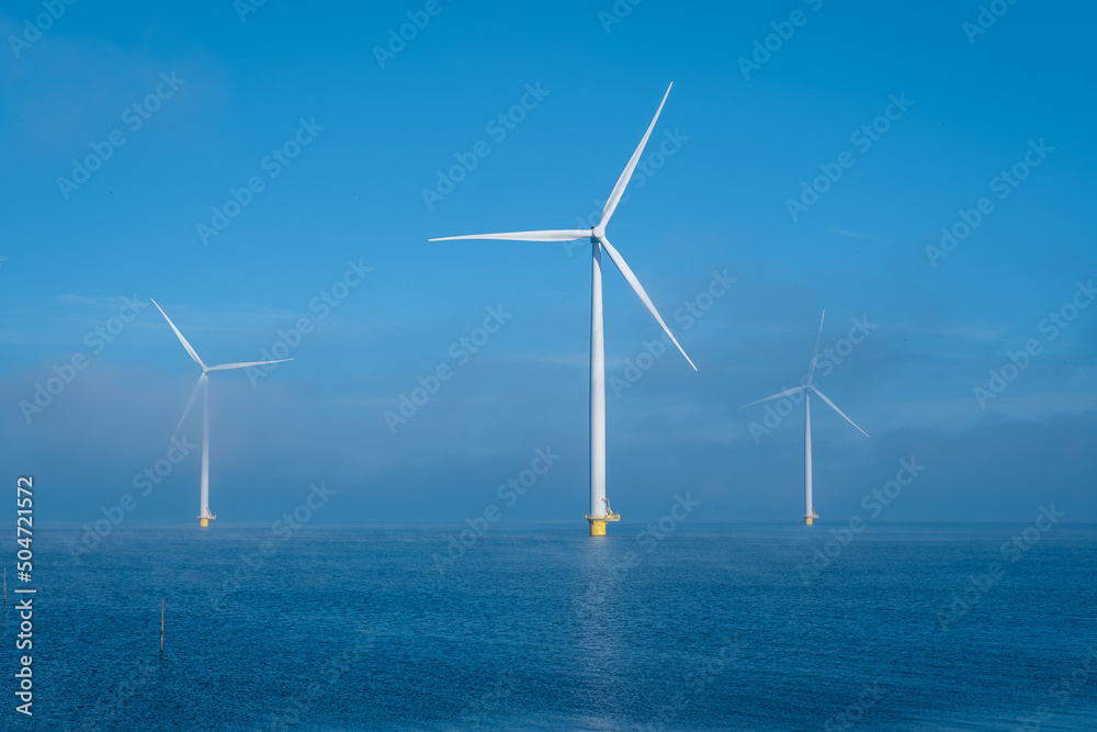 Offshore Windmill farm in the ocean Westermeerwind park, windmills ...