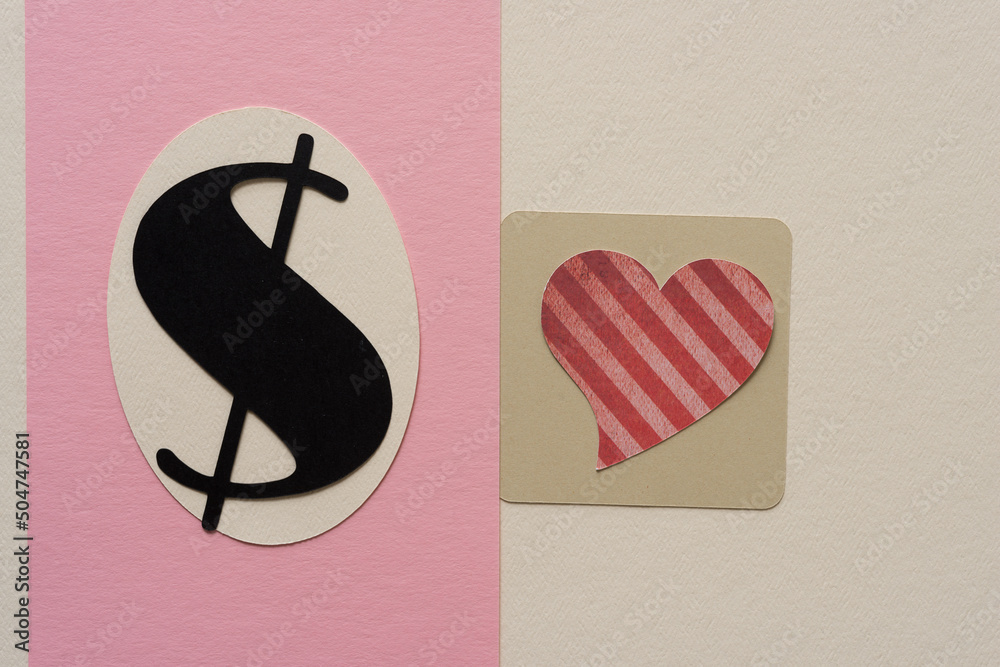 love of money (black paper dollar sign and striped paper heart with ...