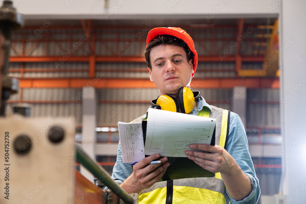 Selective focus at engineer men inspector wearing safety equipment ...