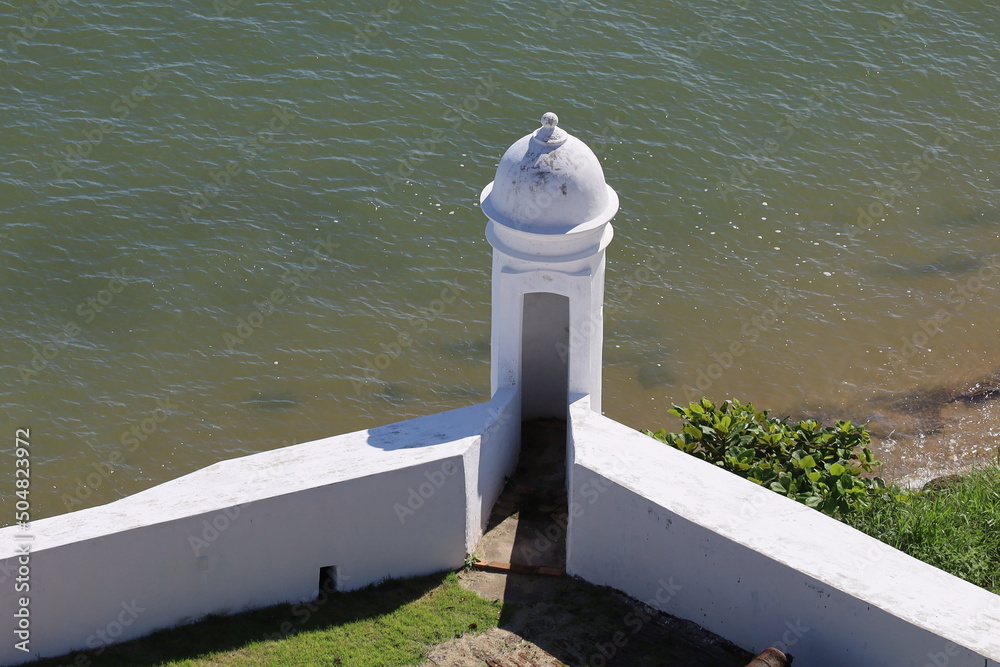 Corner gun, turret with an embrasure, on the wall, of the fortress fort ...