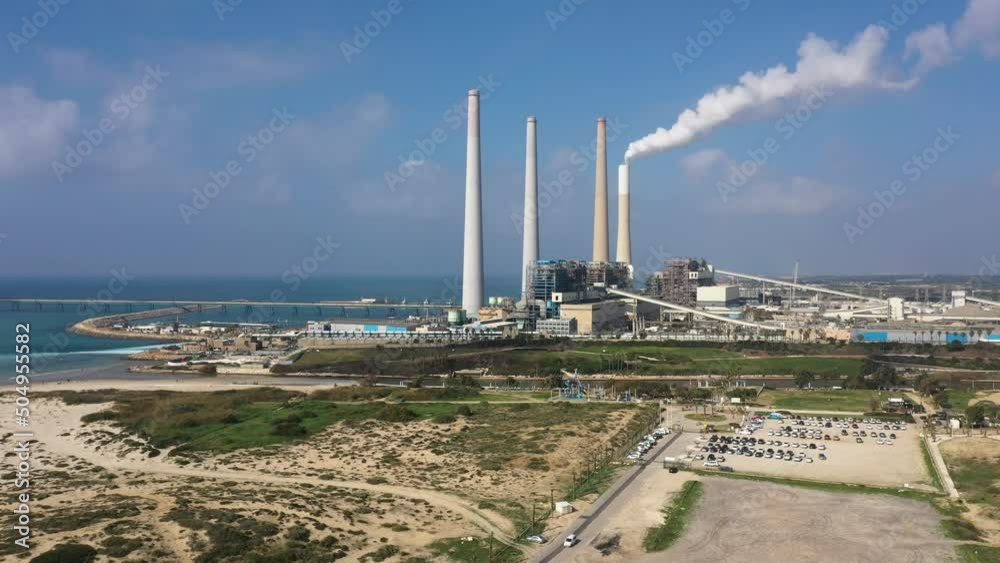 Hadera Park, Orot Rabin Power plant aerial fly in shot with blue sky ...