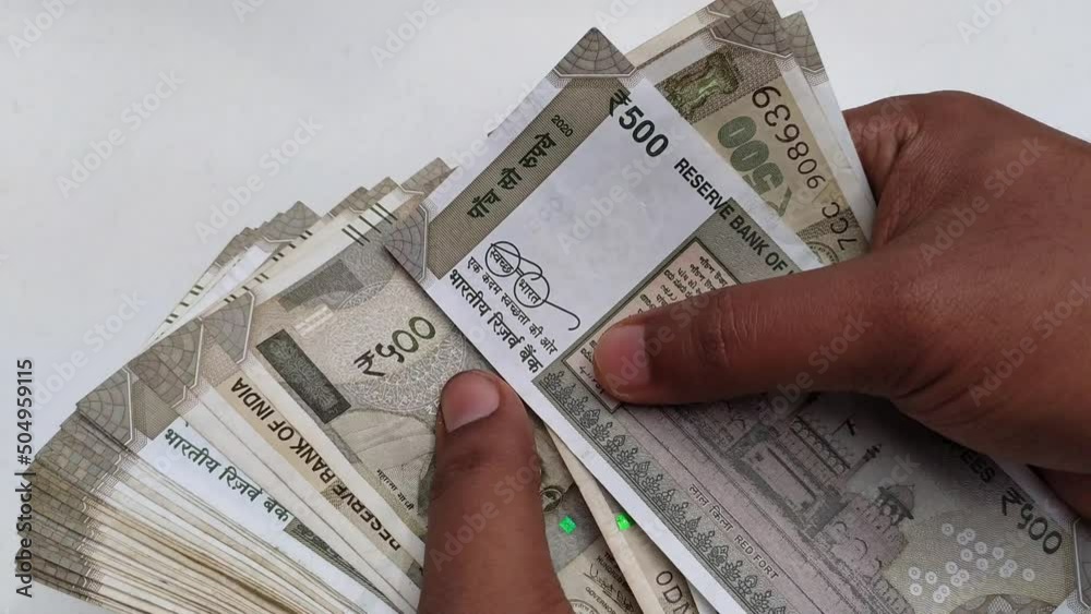 Hand counting bunch of indian currency, money or bank notes bundle of ...